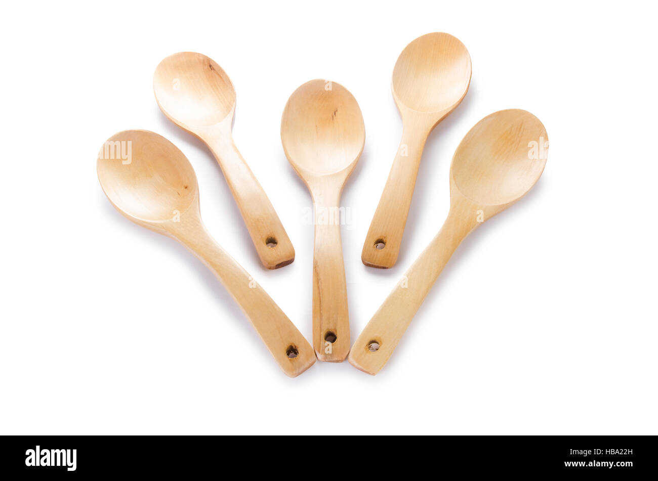 Many wooden spoons isolated on white Stock Photo - Alamy