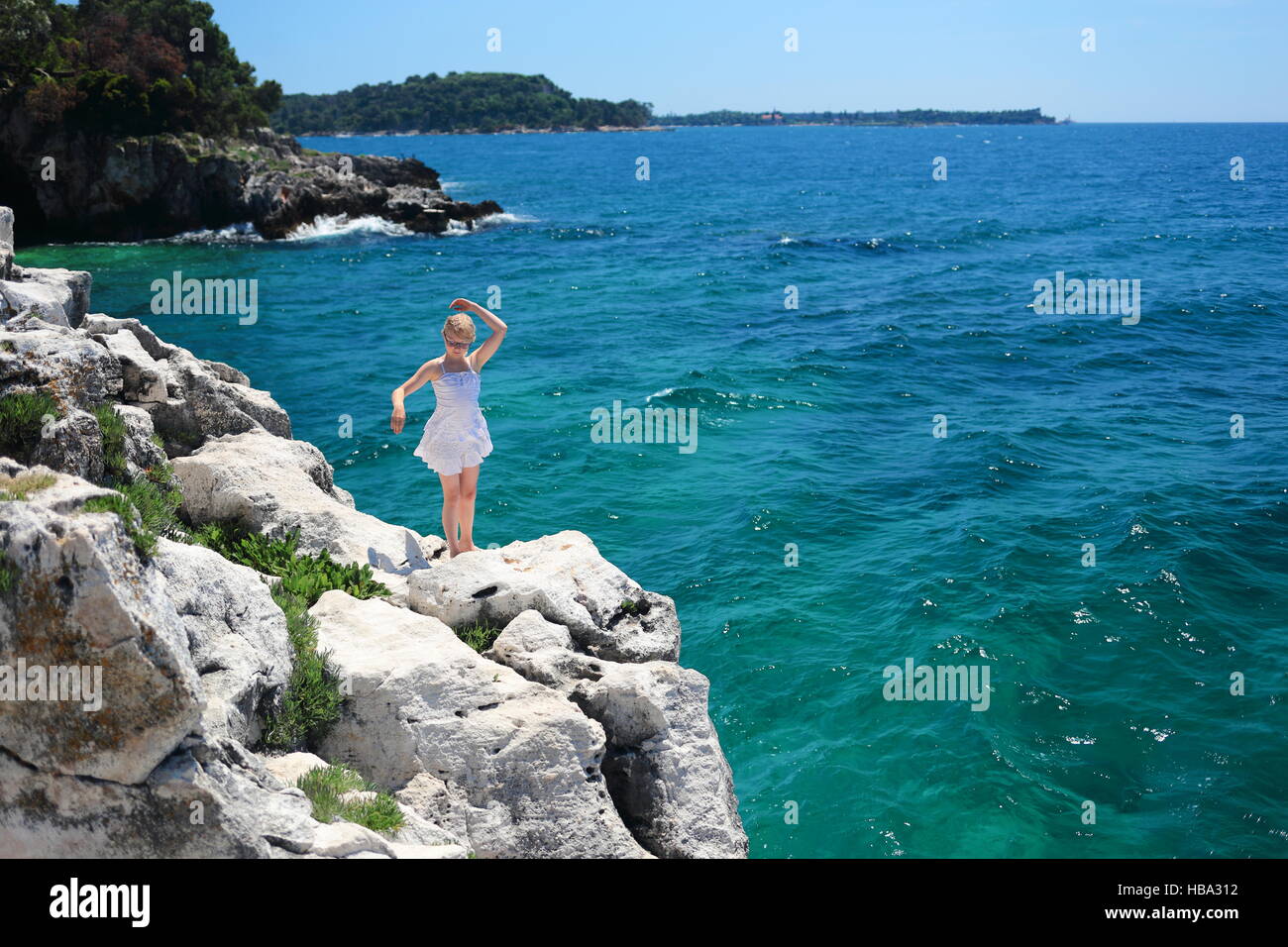 Woman dancing on cliff sea hi-res stock photography and images - Alamy