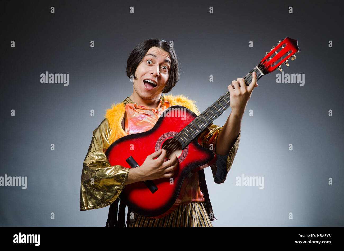 Man with guitar in musical concept Stock Photo - Alamy