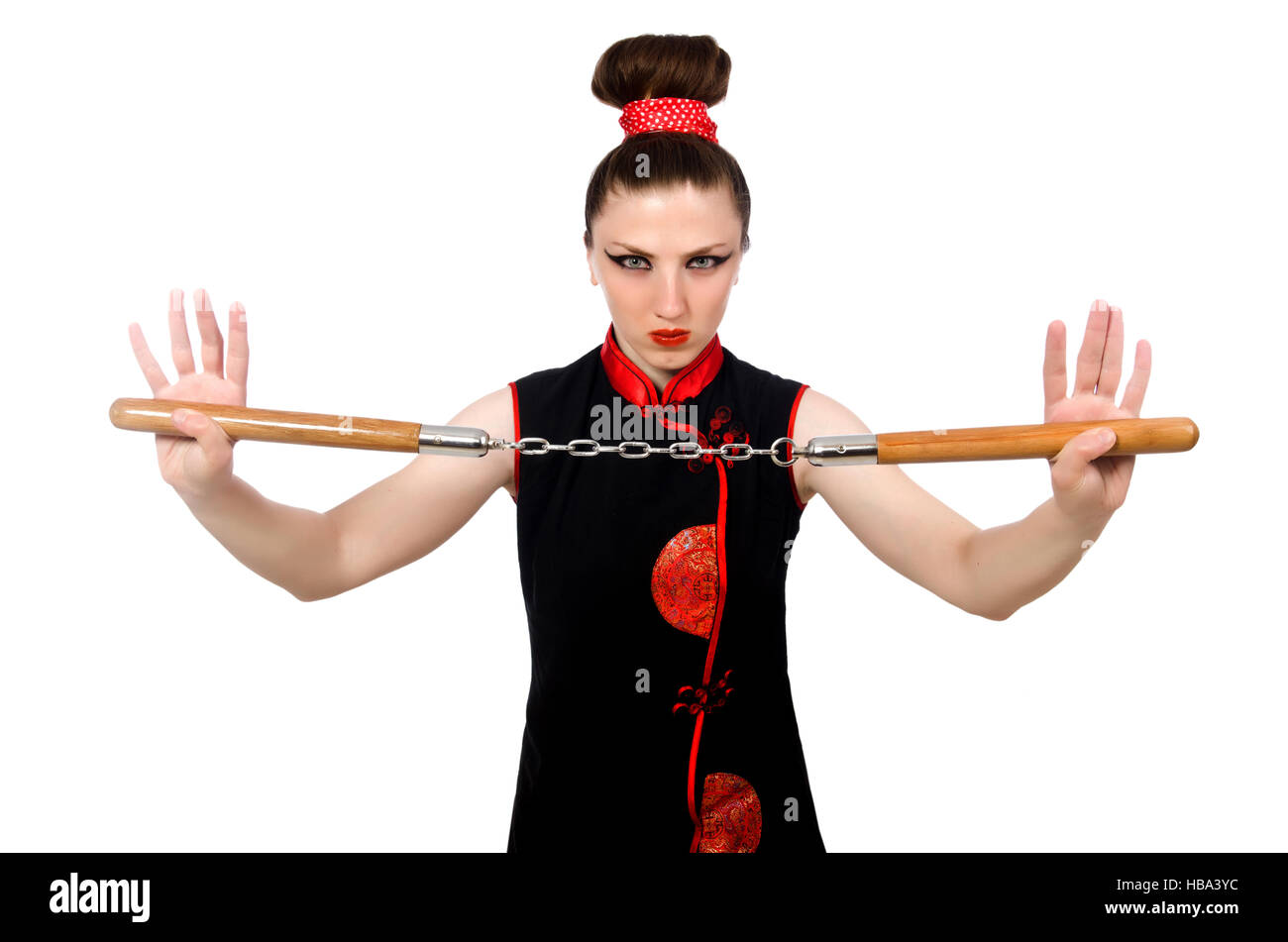 Funny woman with nunchucks isolated on white Stock Photo - Alamy