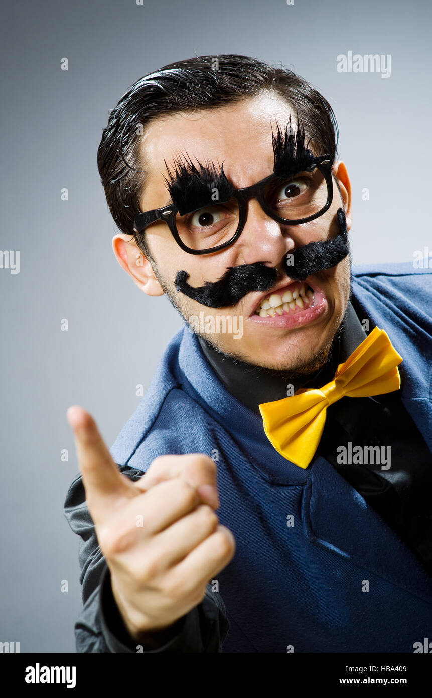 Funny man against dark background Stock Photo - Alamy