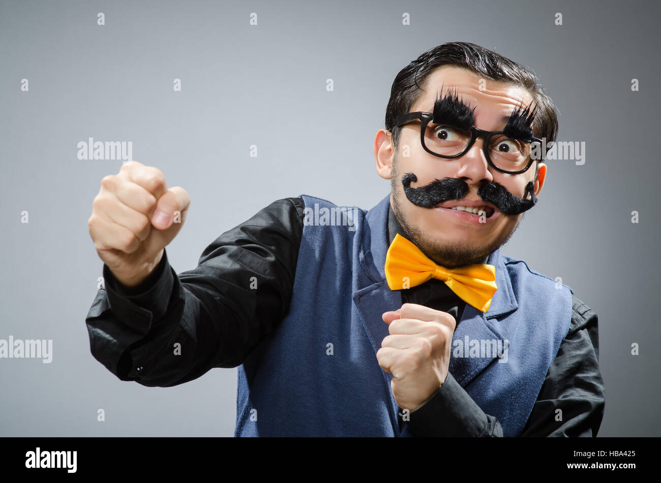 Funny man against dark background Stock Photo - Alamy
