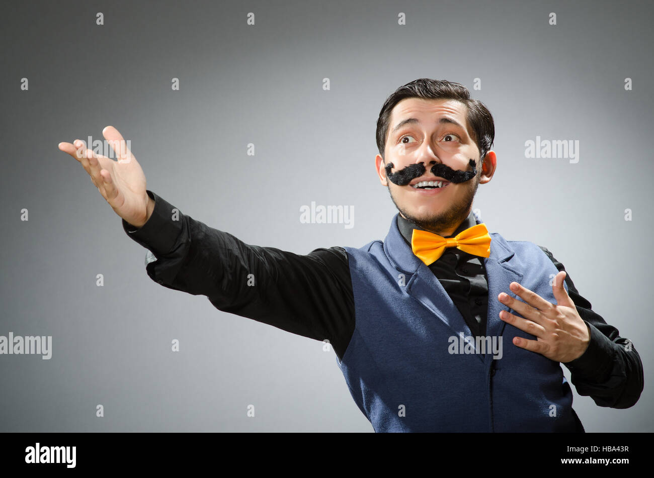 Funny man against dark background Stock Photo - Alamy