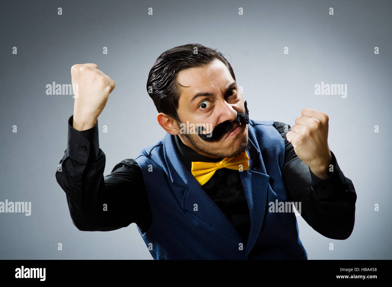 Funny man against dark background Stock Photo - Alamy