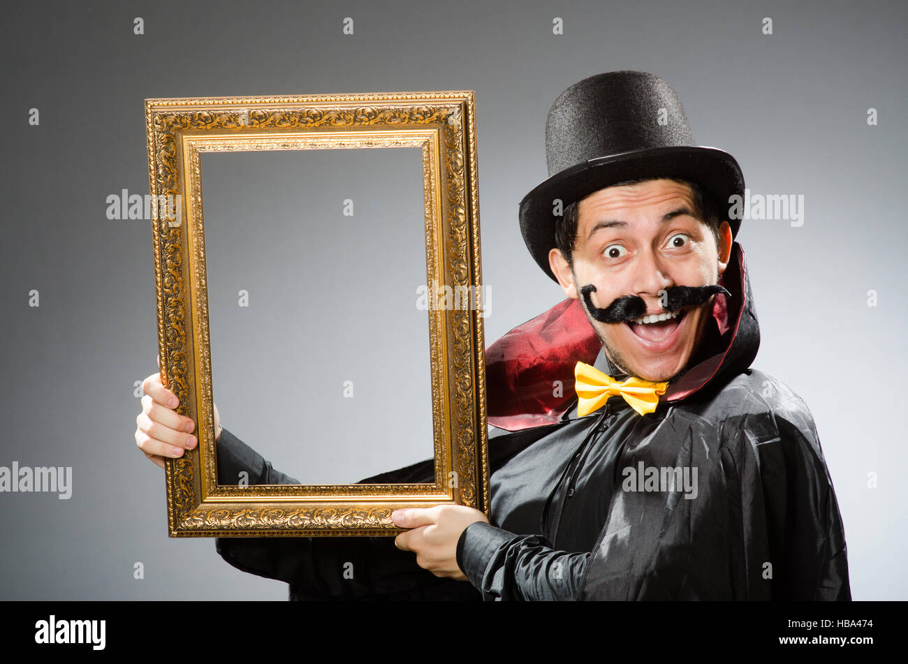 Funny man with picture frame Stock Photo - Alamy
