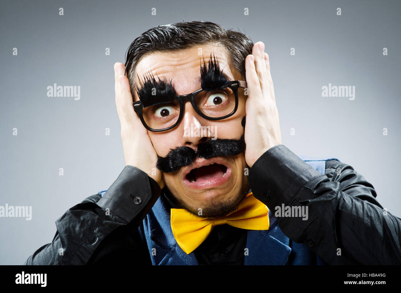 Funny man against dark background Stock Photo - Alamy