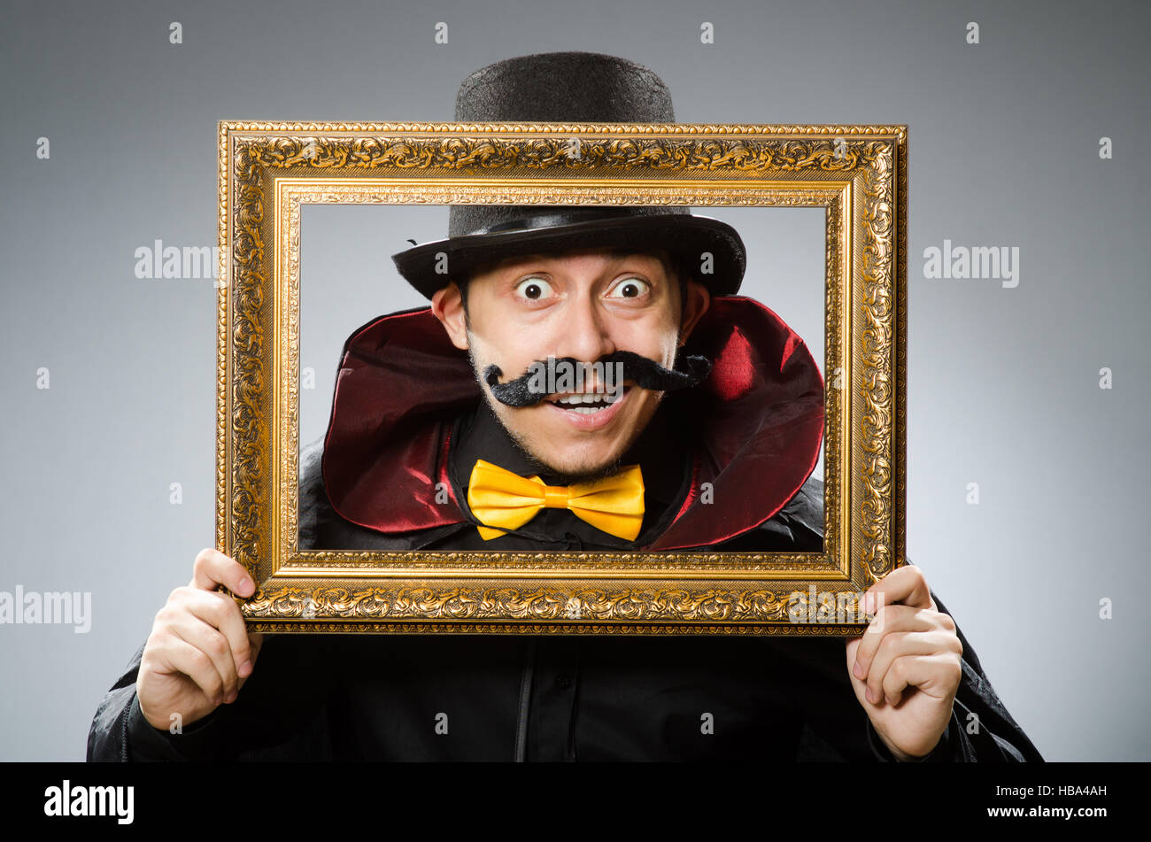 Funny man with picture frame Stock Photo - Alamy