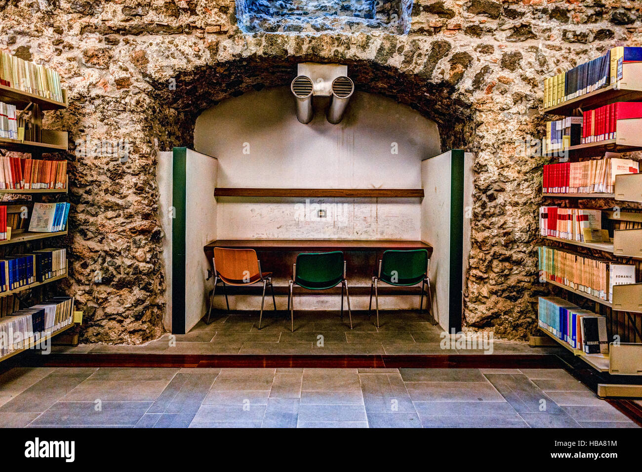 library setting with books and reading material Stock Photo - Alamy