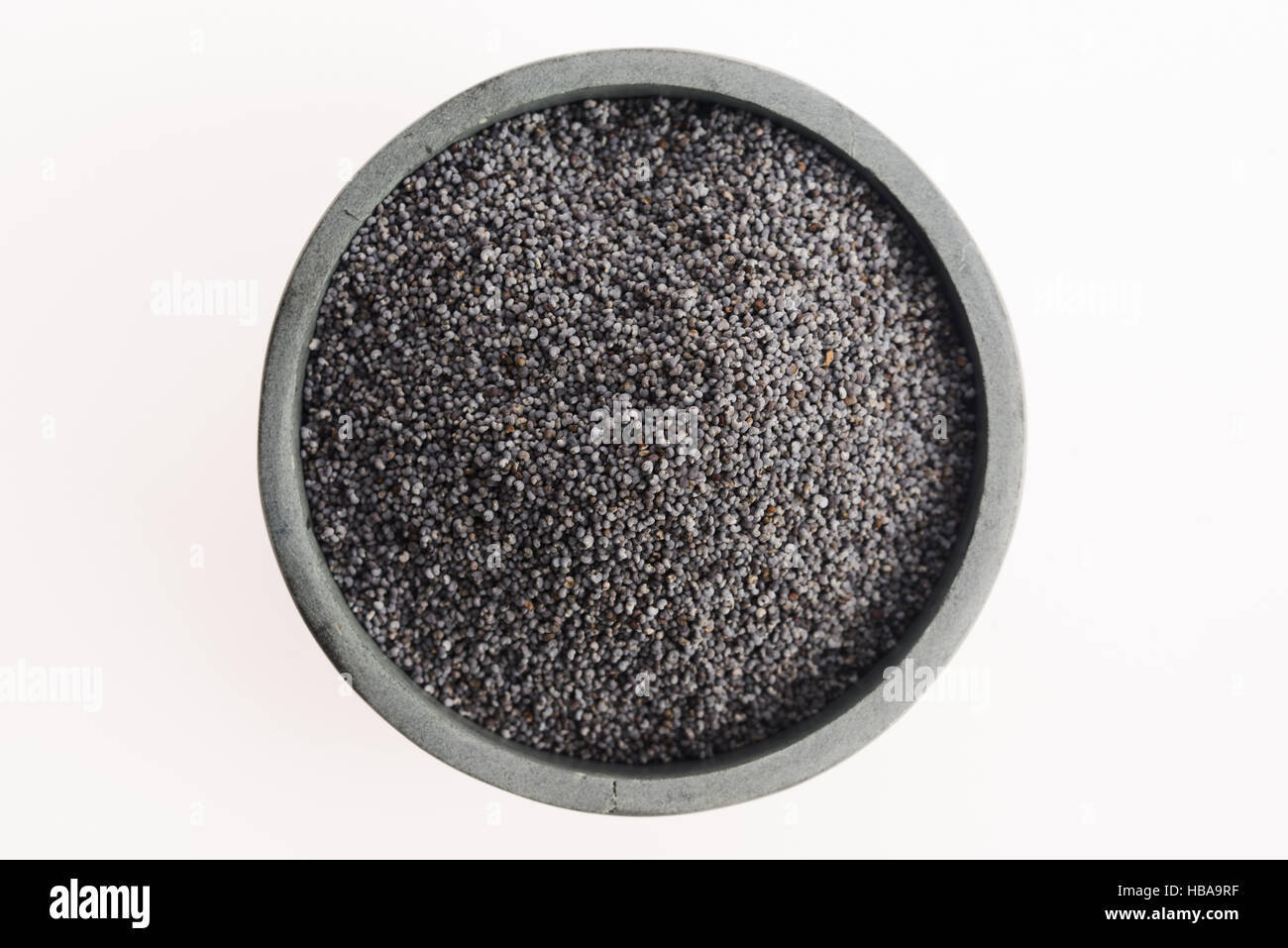 Poppy seeds isolated on white Stock Photo - Alamy