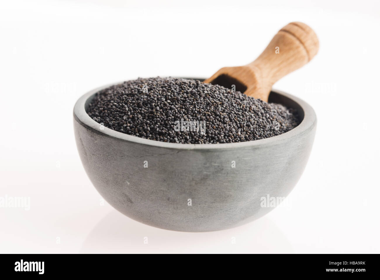 Poppy seeds isolated on white Stock Photo - Alamy