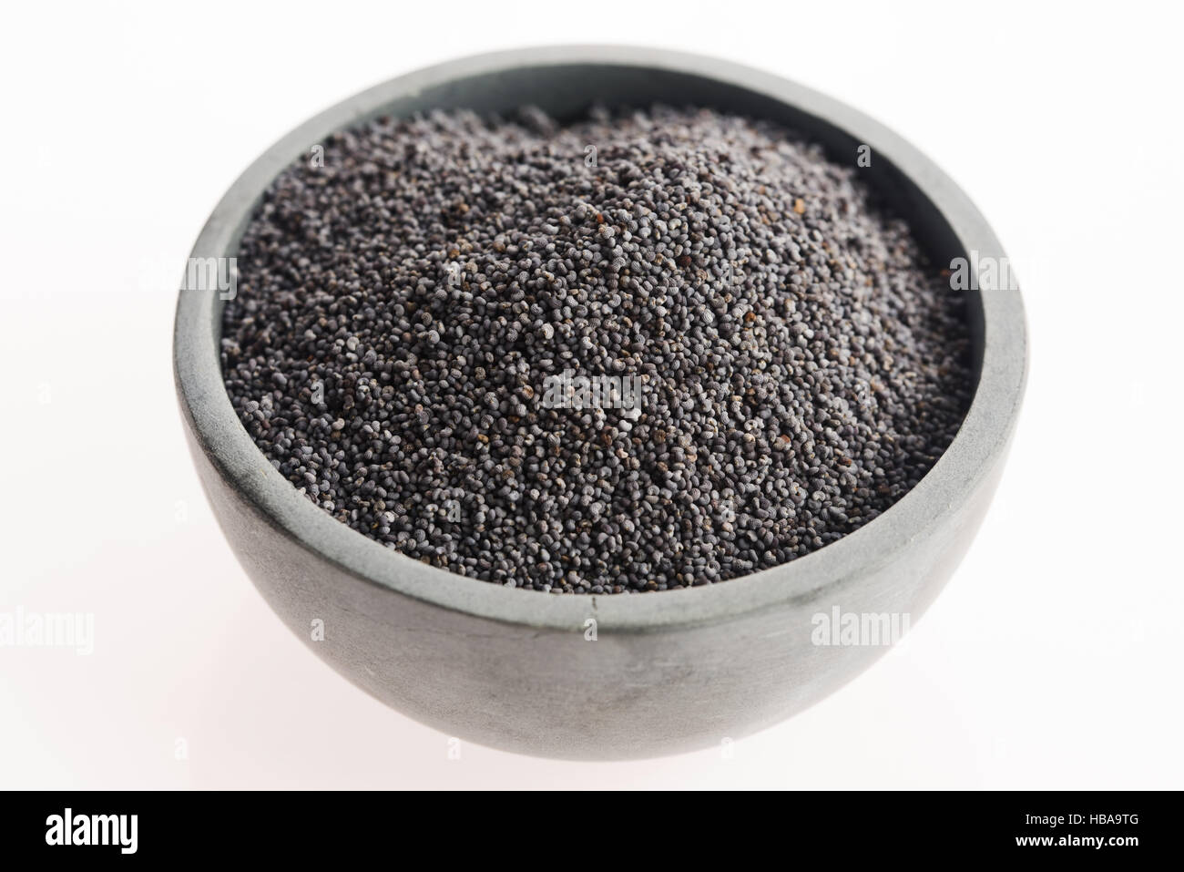 Poppy seeds isolated on white Stock Photo - Alamy