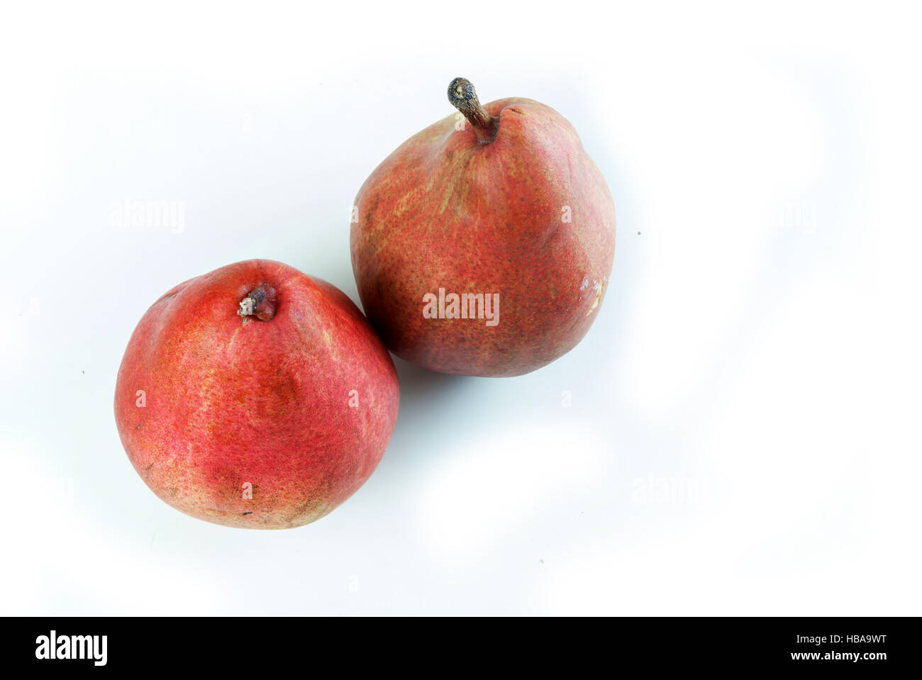Ripe red pear fruits on white background Stock Photo - Alamy