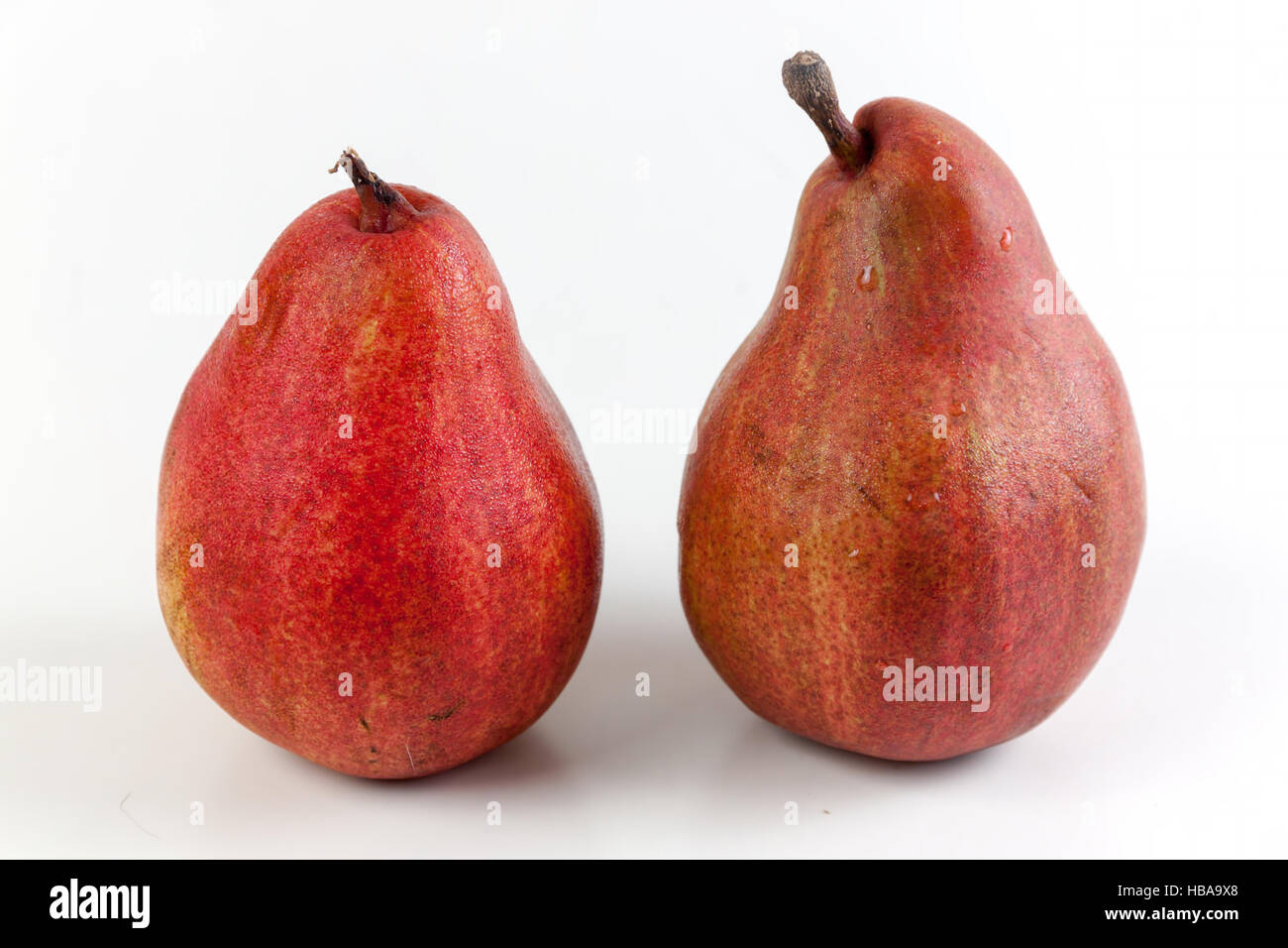 Ripe red pear fruits on white background Stock Photo - Alamy
