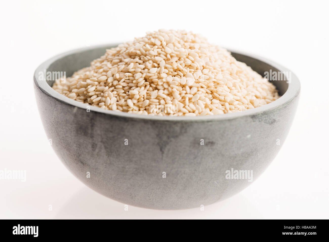 sesame seeds isolated on white background Stock Photo - Alamy