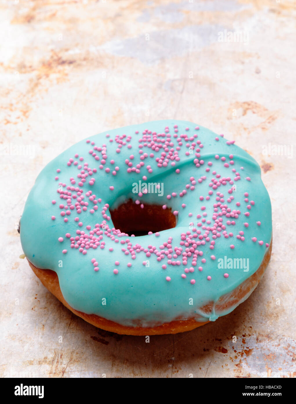 donut with turquoise frosting Stock Photo - Alamy