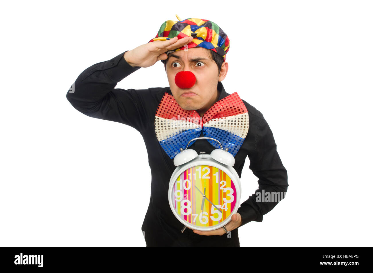 Funny clown with clock isolated on white Stock Photo - Alamy
