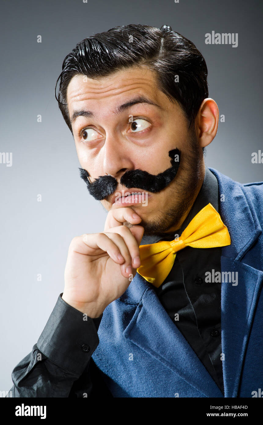 Funny man against dark background Stock Photo - Alamy