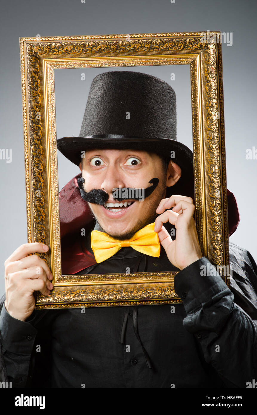 Funny man with picture frame Stock Photo - Alamy