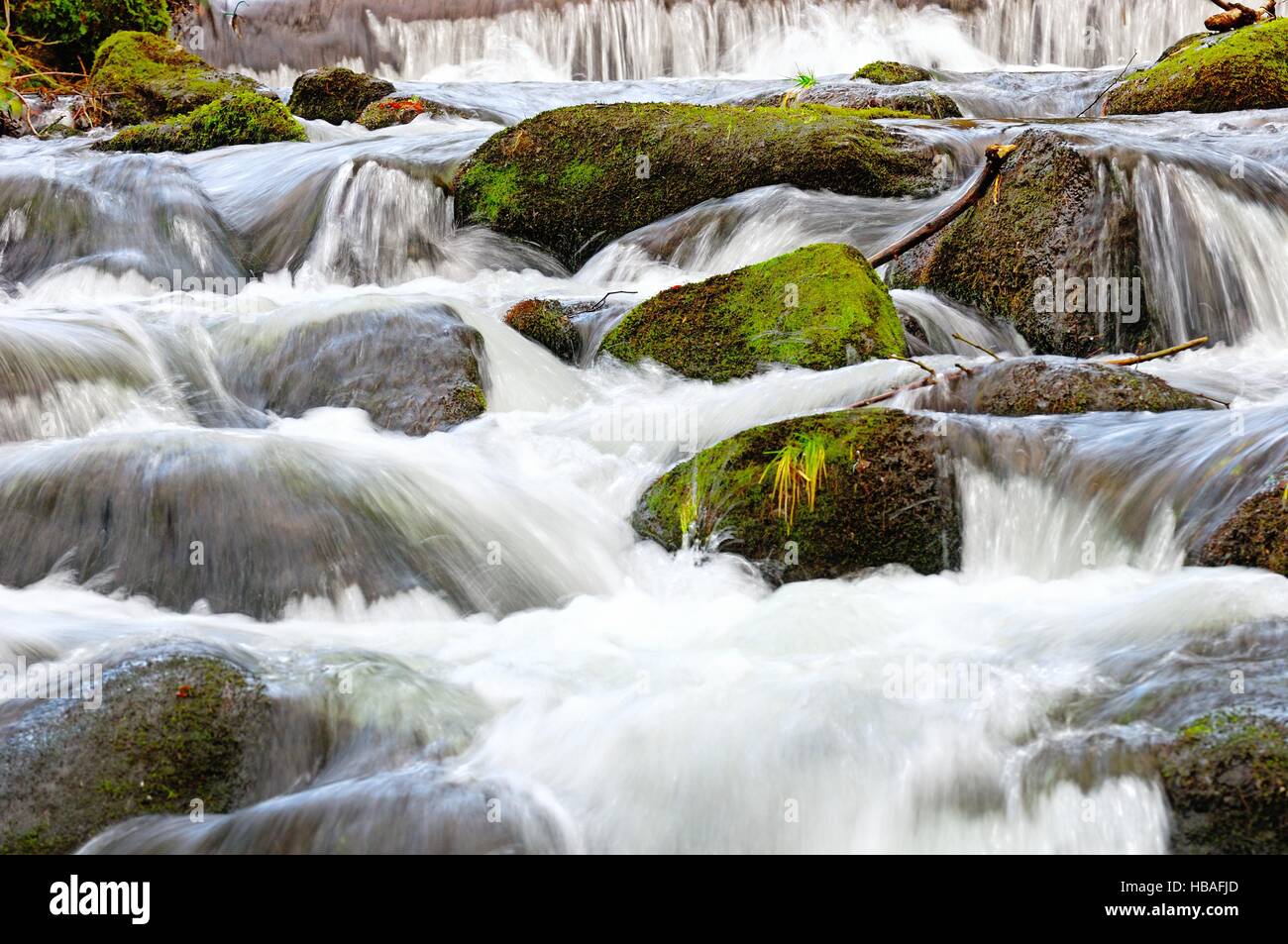 River water flowing between stones hi-res stock photography and images ...