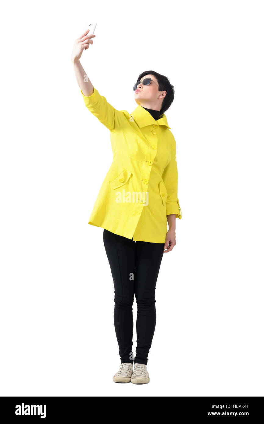 Young short hair brunette girl talking selfie from high angle. Full ...