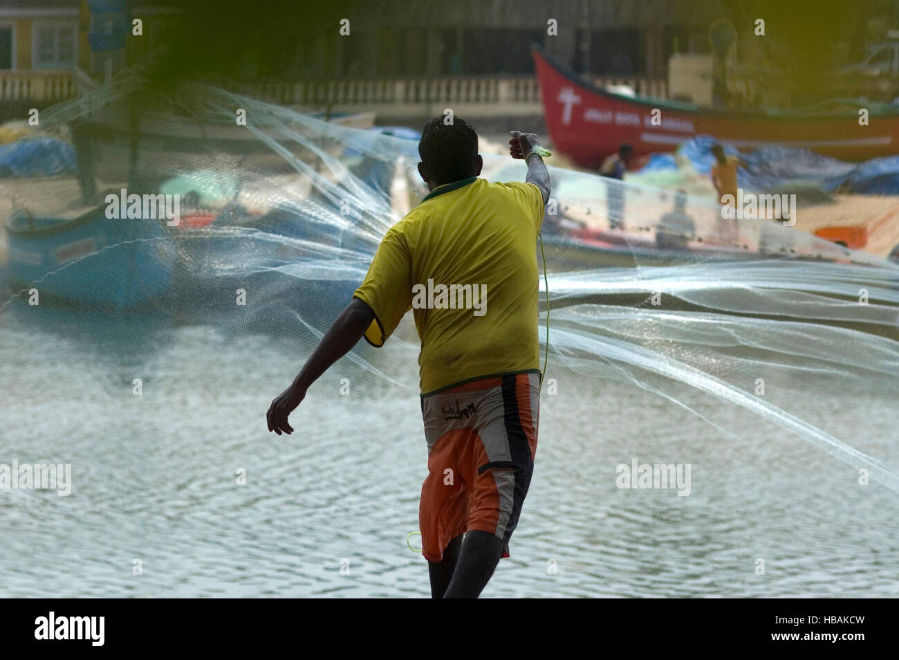 Fisherman throwing fish net hi-res stock photography and images - Alamy