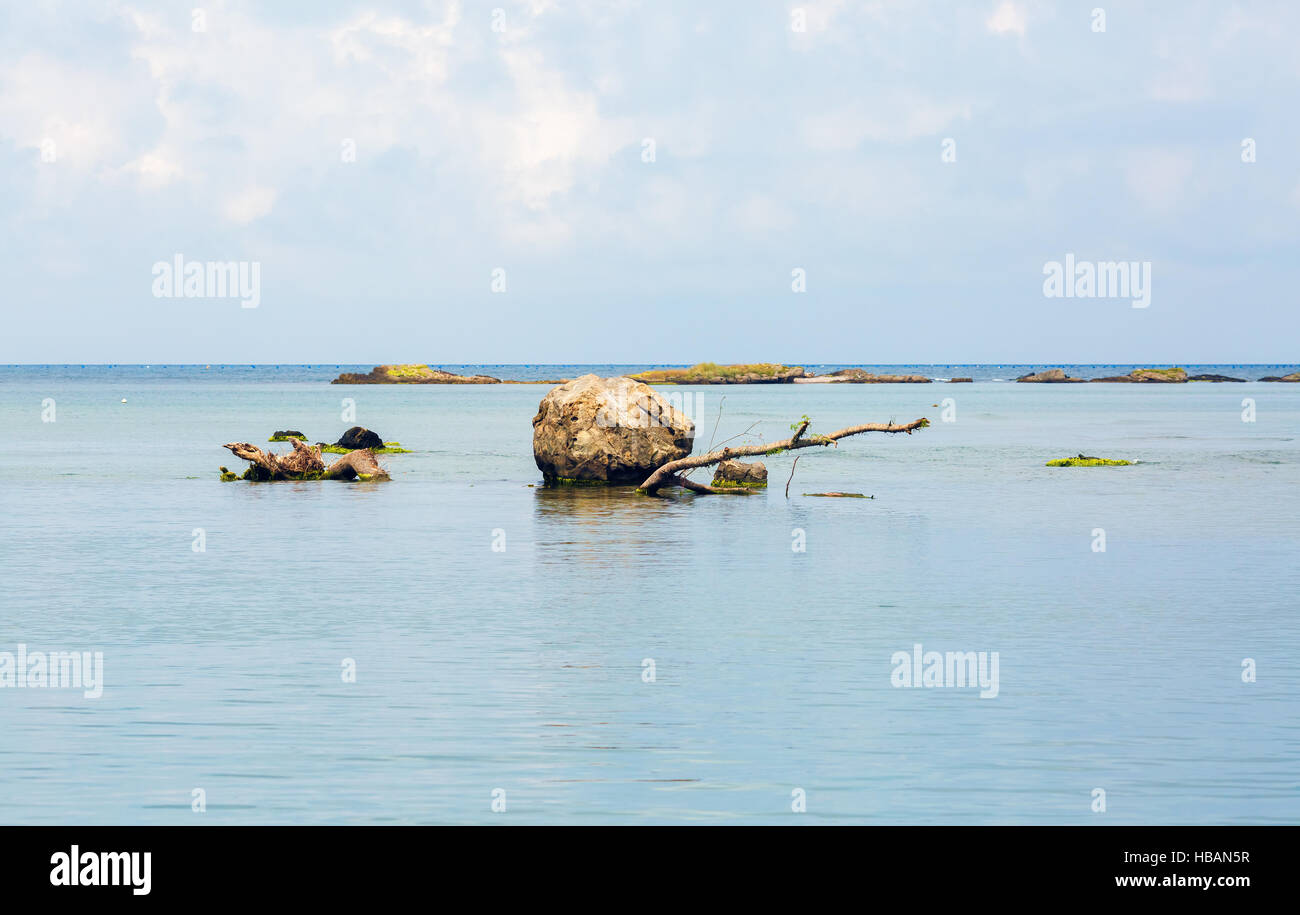 Large boulder in the water Stock Photo - Alamy