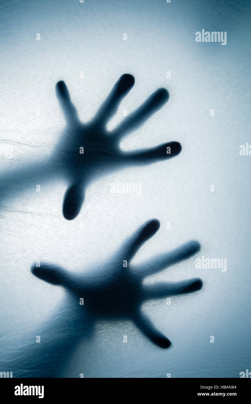 Hands silhouetted against a translucent screen Stock Photo - Alamy