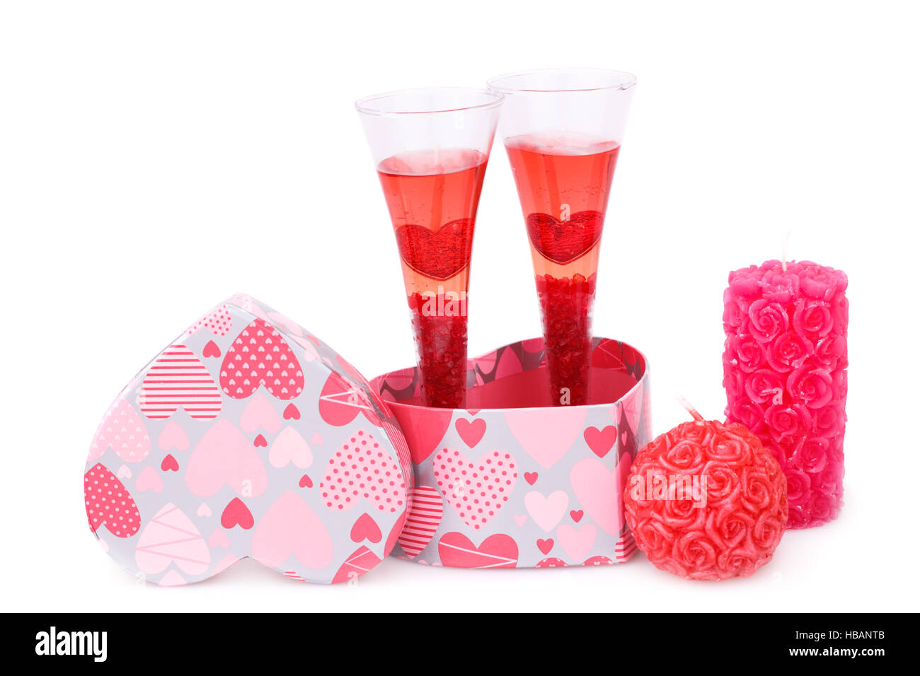 Two glasses, candles, gift box isolated on white background Stock Photo ...