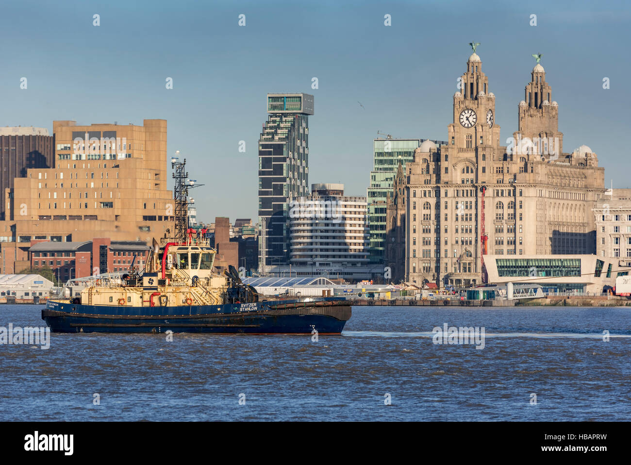Tug Svitzer Stanlow in the river Mersey with Liverpool waterfront ...