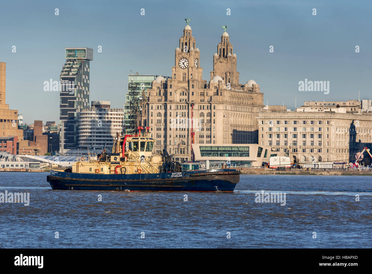 Tug Svitzer Stanlow in the river Mersey with Liverpool waterfront ...