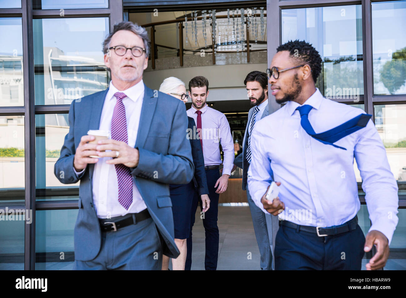 Group business people leaving office hi-res stock photography and ...