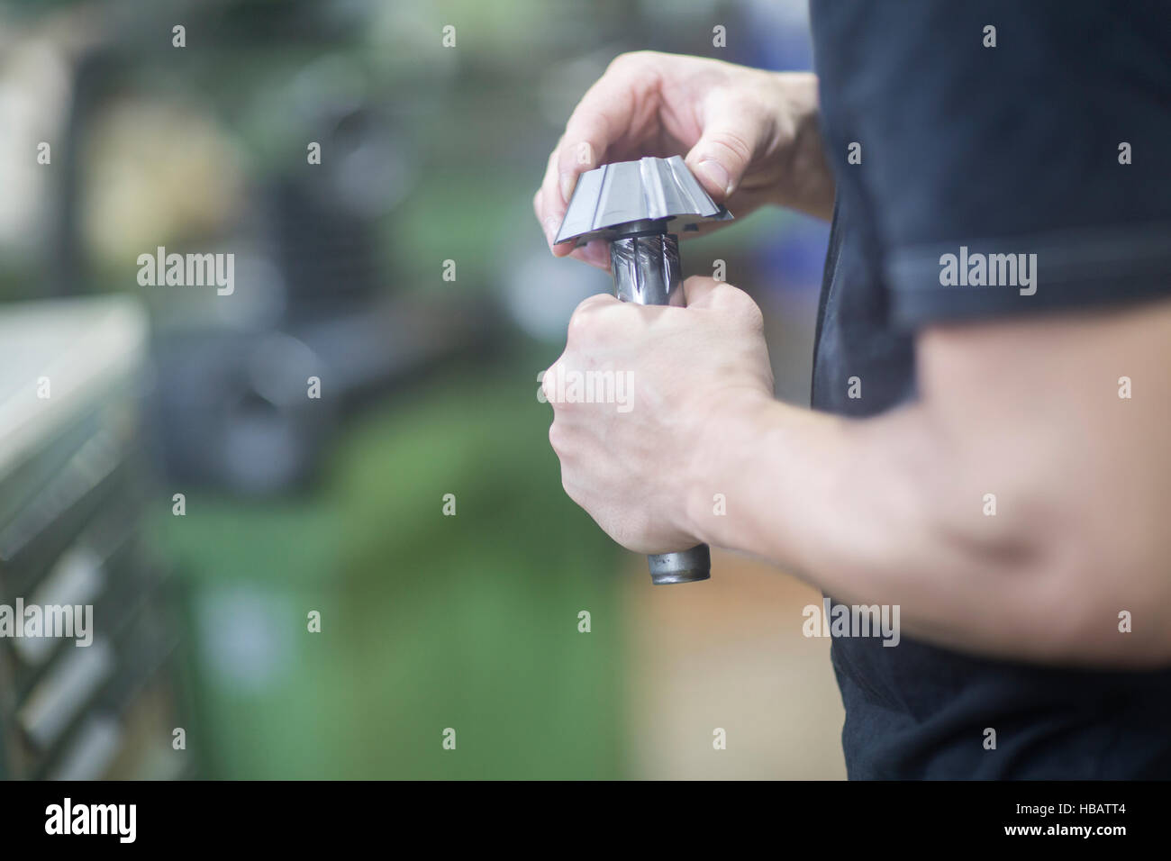 Man repairing machinery part Stock Photo - Alamy