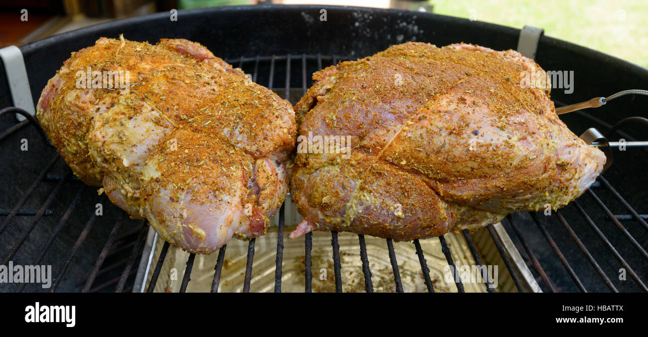 Pulled pork cooking and grilling inside a barbecue Stock Photo - Alamy