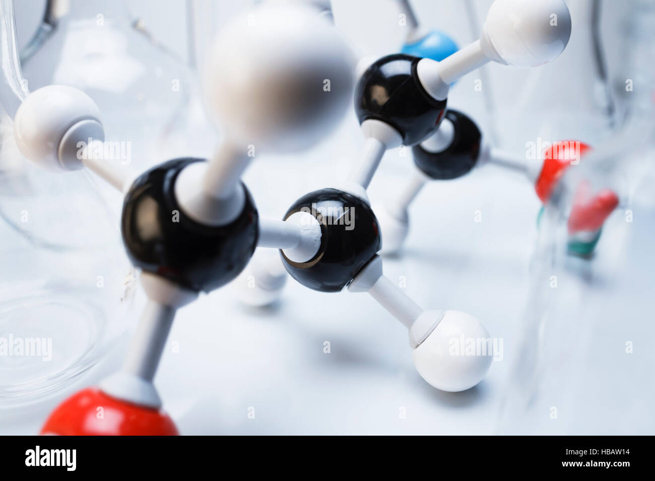 Ball and stick molecular model and laboratory flasks Stock Photo - Alamy