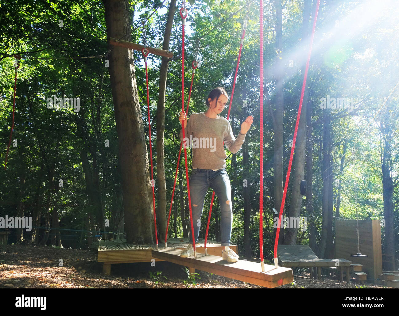Woman balancing on bridge hi-res stock photography and images - Alamy