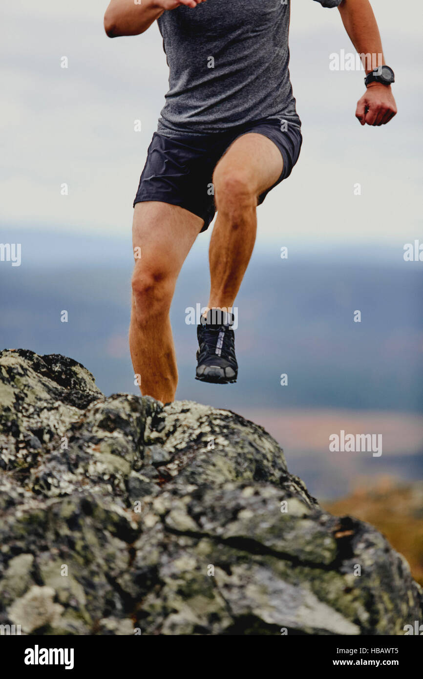 Man running on rocky cliff top, Keimiotunturi, Lapland, Finland Stock ...