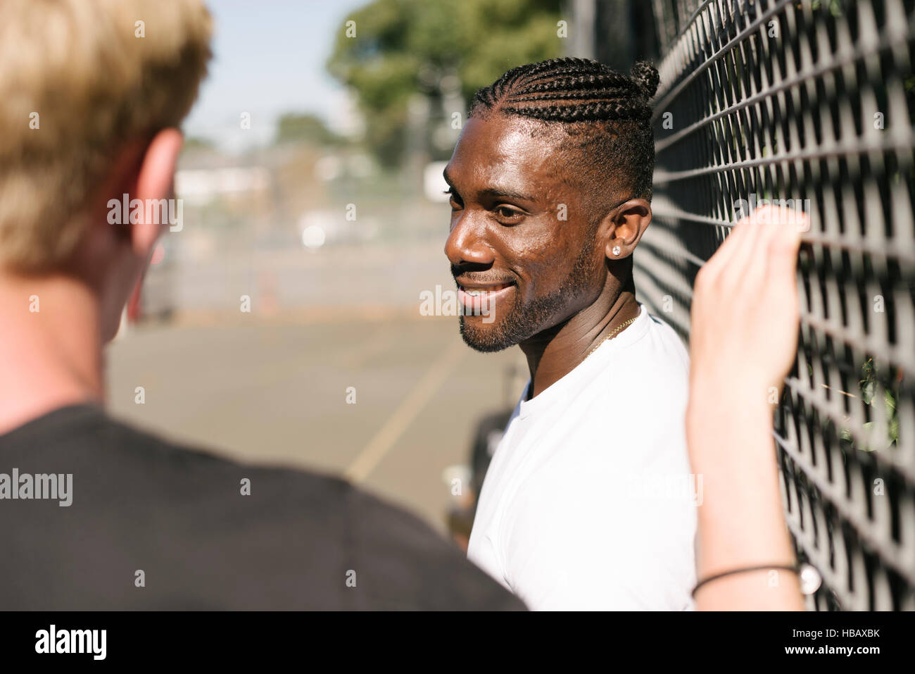 Group of young men chatting hi-res stock photography and images - Alamy