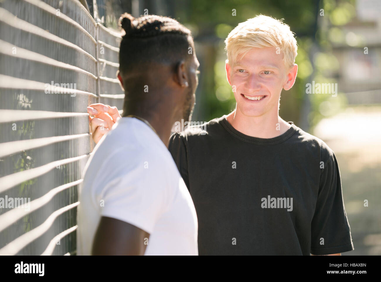 Group of young men chatting hi-res stock photography and images - Alamy