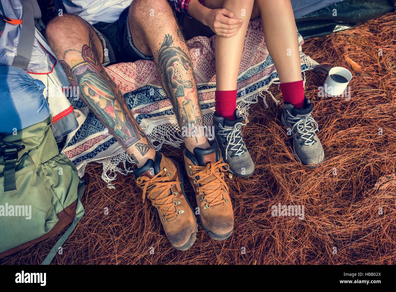 Couple Legs Relaxing Camping Outdoors Concept Stock Photo - Alamy