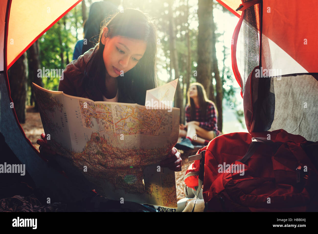 Girl Reading Map Traveling Destination Camping Concept Stock Photo - Alamy
