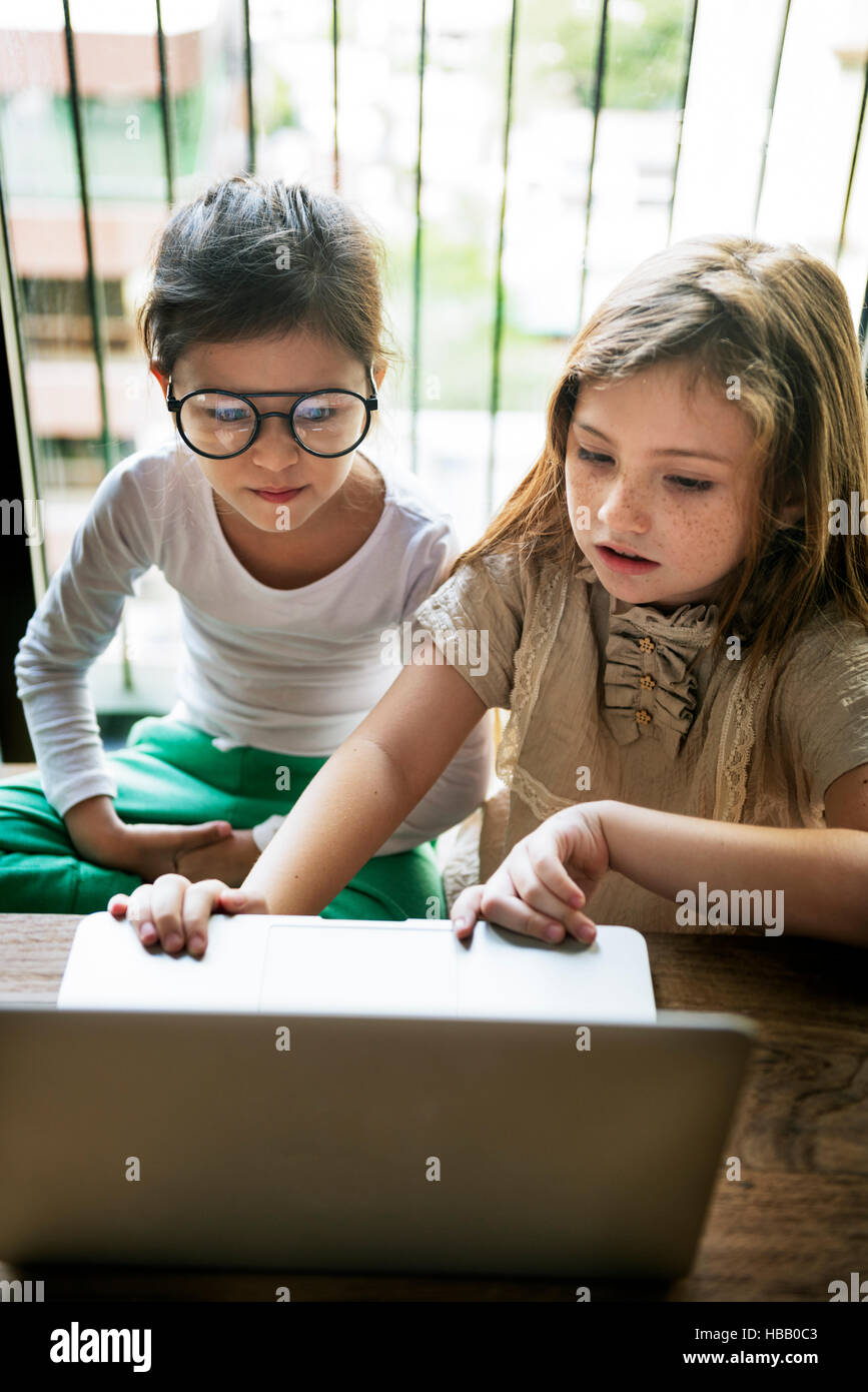 Girls Using Computer Concentrated Concept Stock Photo - Alamy