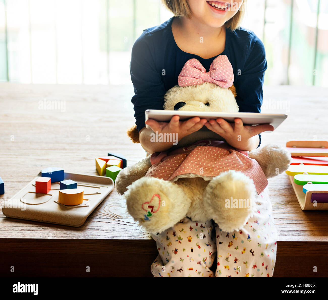 Little Girl Using Device Concept Stock Photo - Alamy