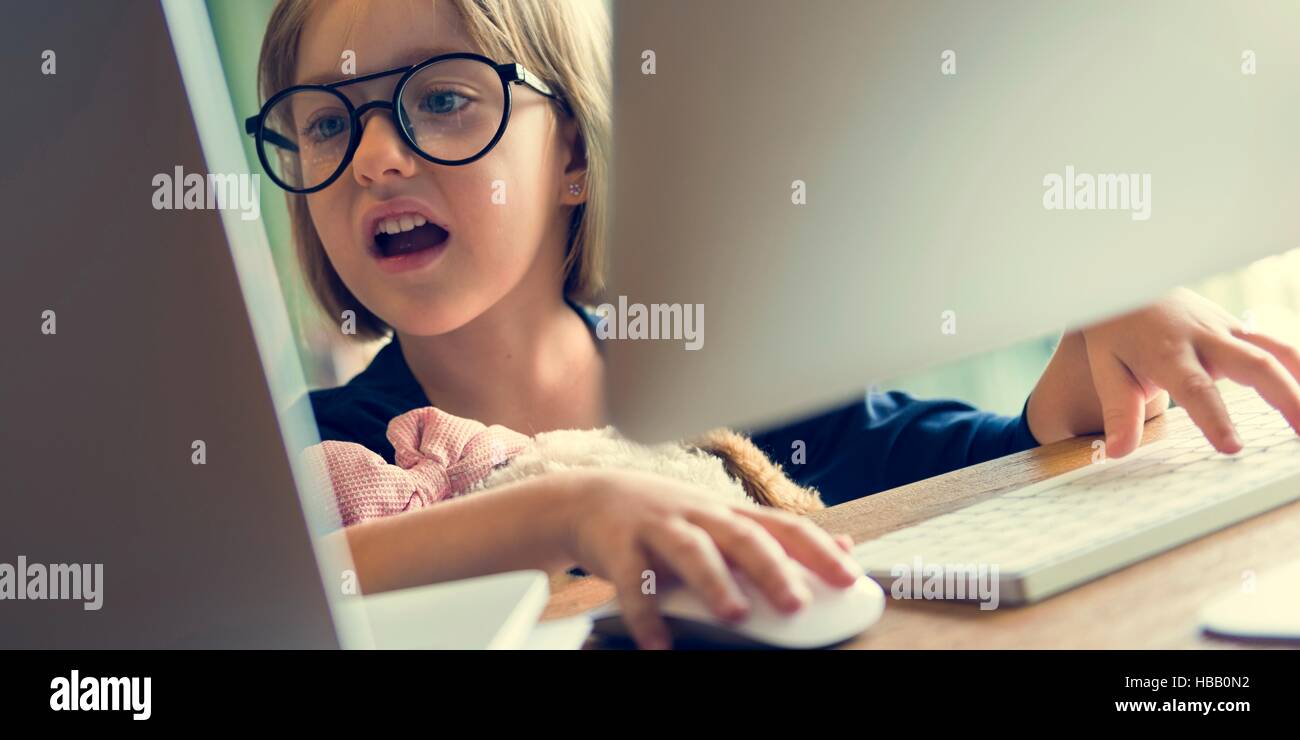 Little Girl Using Device Concept Stock Photo - Alamy