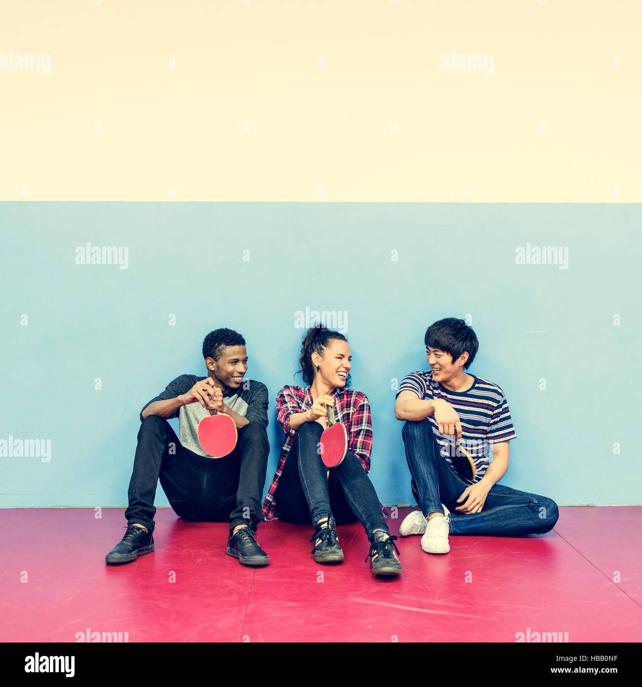 Diverse friends playing tennis hi-res stock photography and images - Alamy