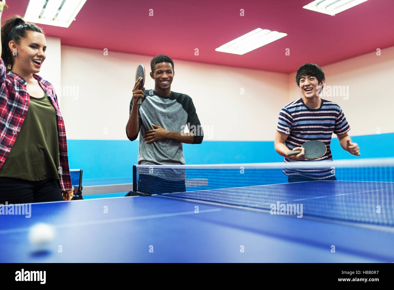Diverse friends playing tennis hi-res stock photography and images - Alamy