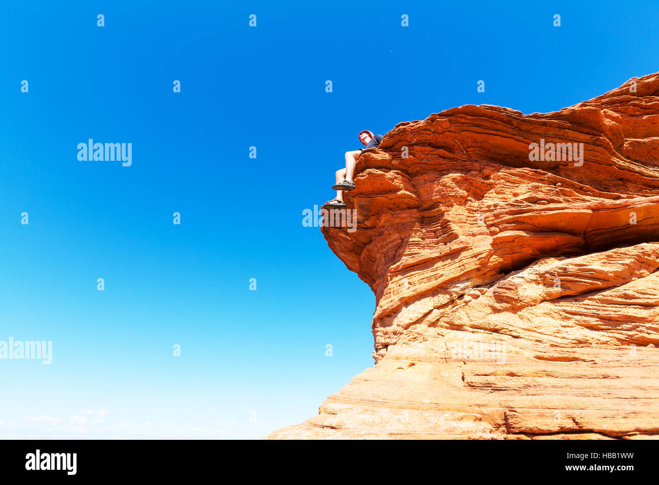 Man on the cliff Stock Photo - Alamy