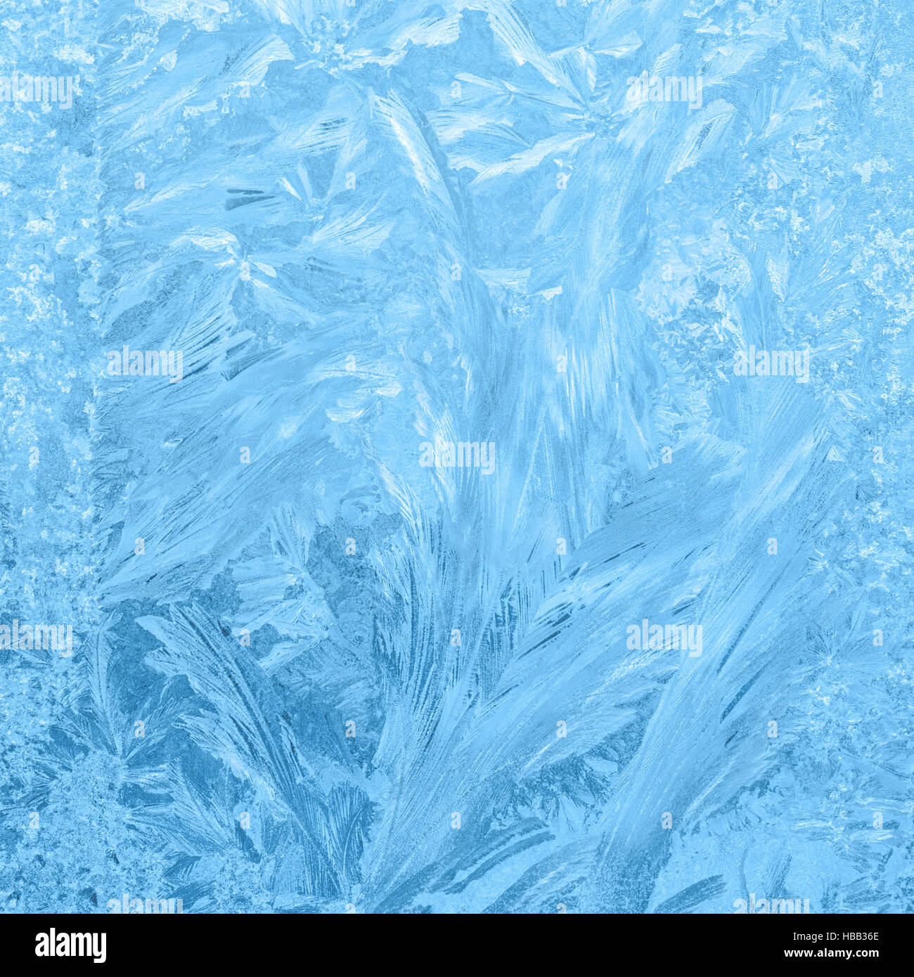 beautiful winter ice, blue texture on window, festive background, close ...
