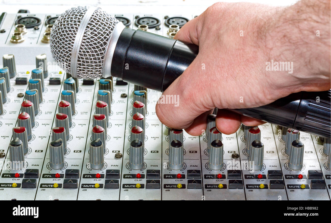 Hand with microphone Stock Photo - Alamy