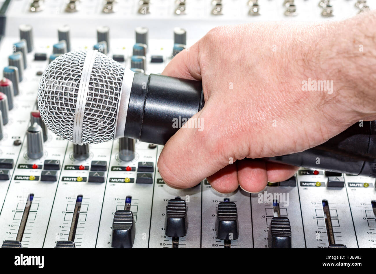 Hand with microphone Stock Photo - Alamy