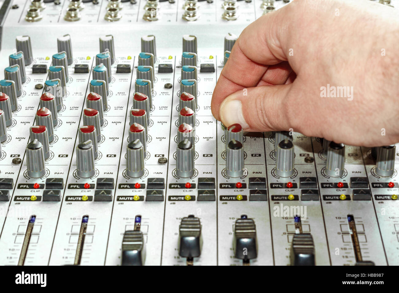 Hand and audio mixer Stock Photo - Alamy